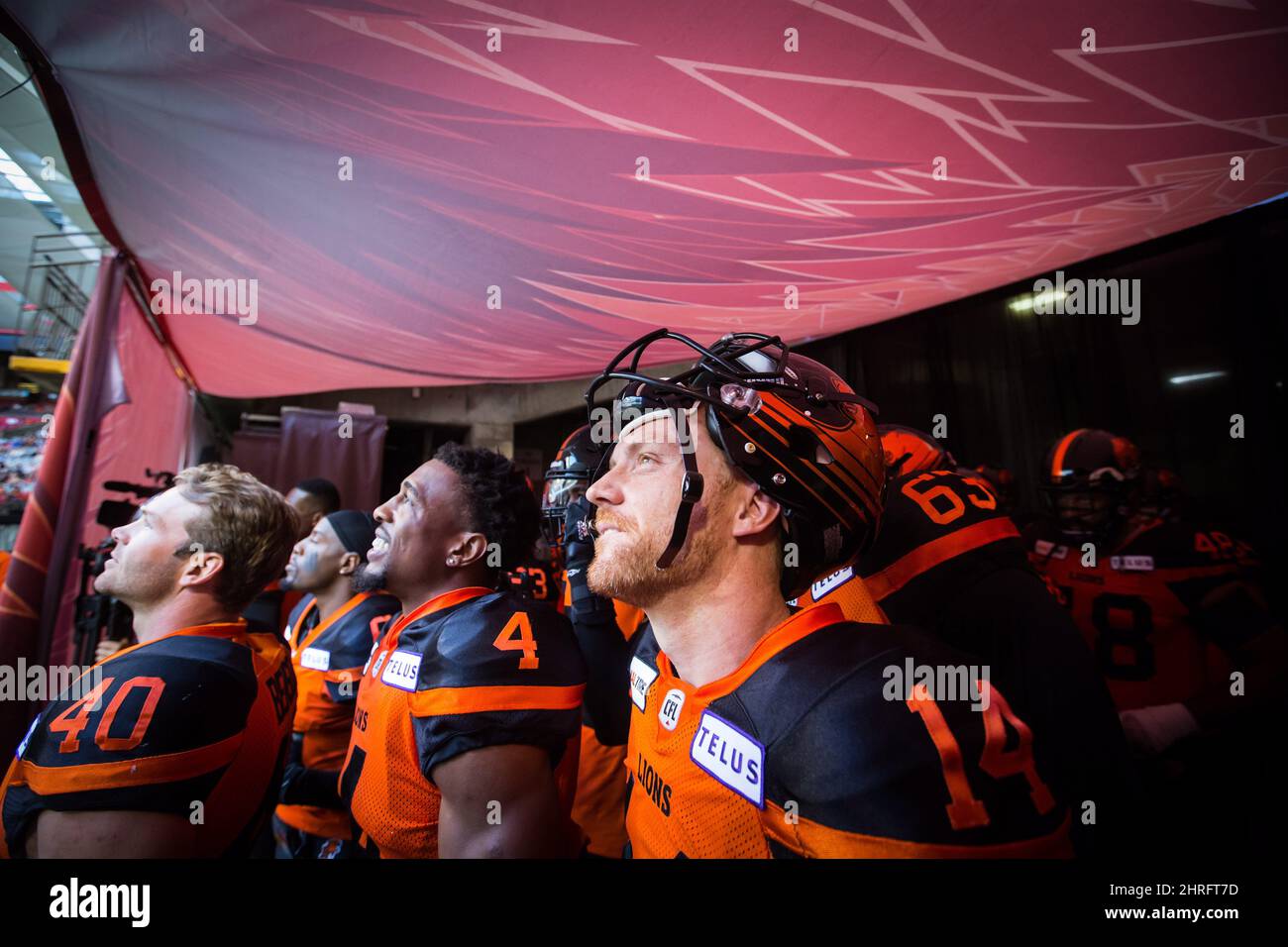 B.C. Lions quarterback Travis Lulay (14) stands with Mike Benson (40 ...