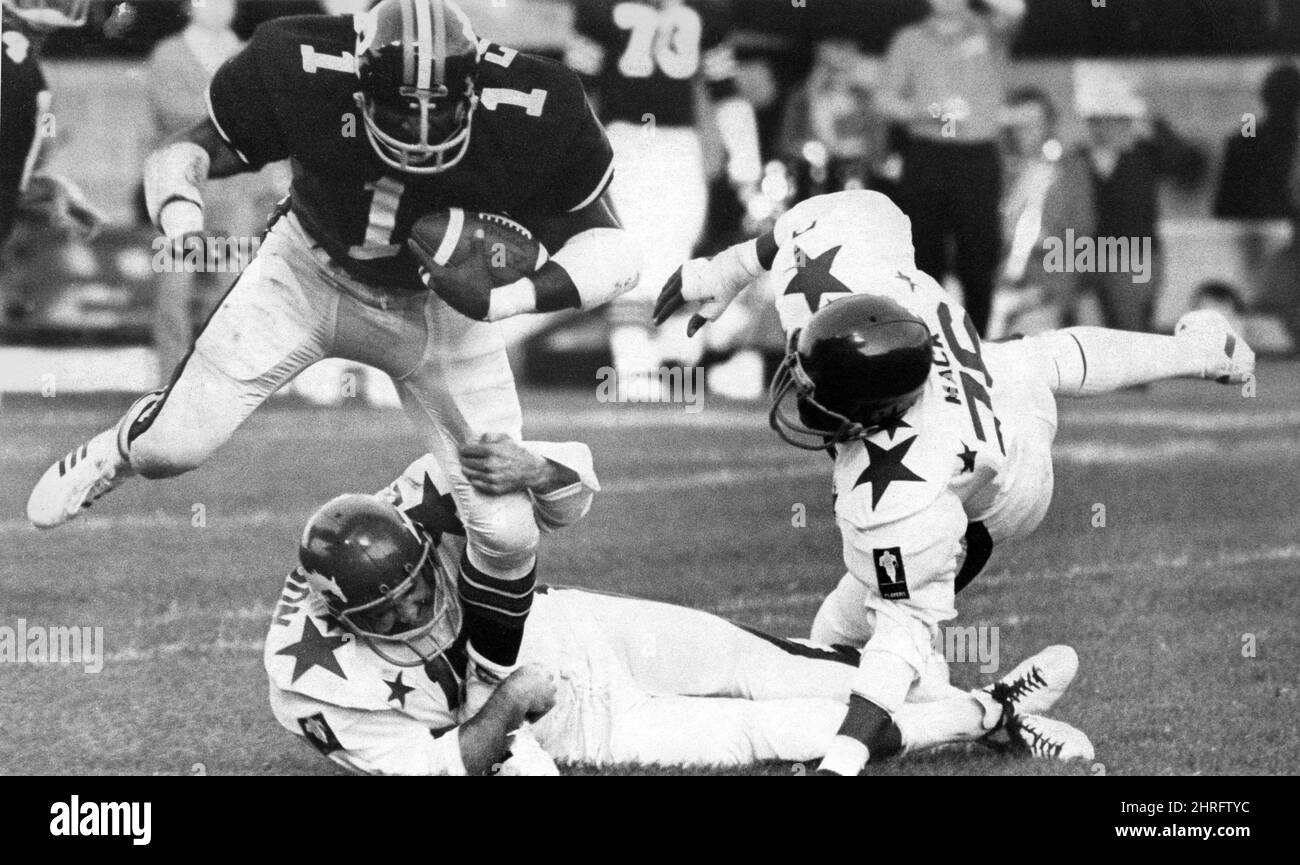 Gene Foster of the Ottawa Rough Riders (top left) is tackled by All ...