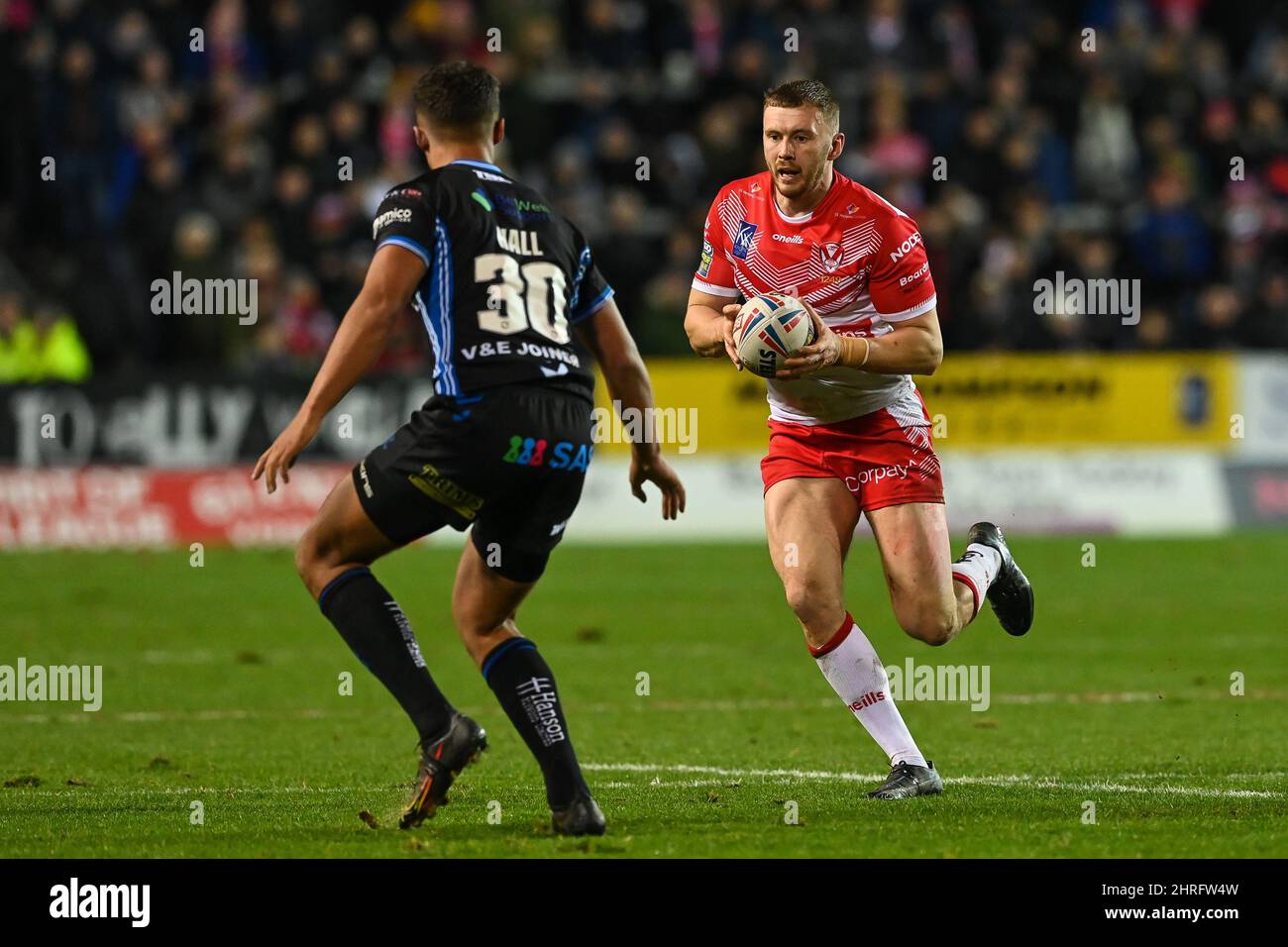 Joe Batchelor #12 of St Helens makes a break Stock Photo - Alamy