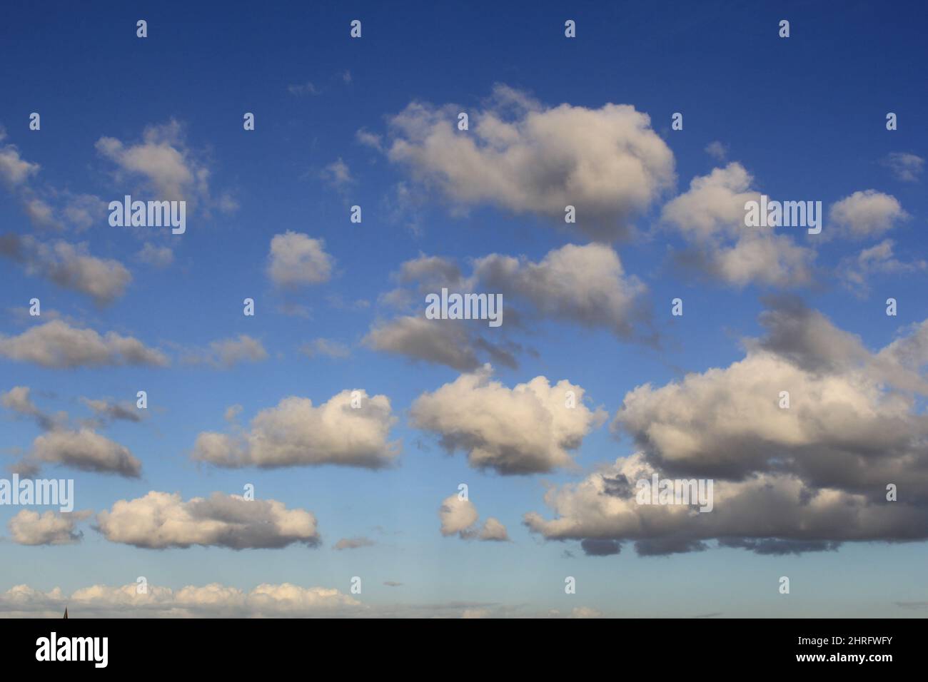 a cloudscape with a typical dutch blue sky with beautiful white clouds ...