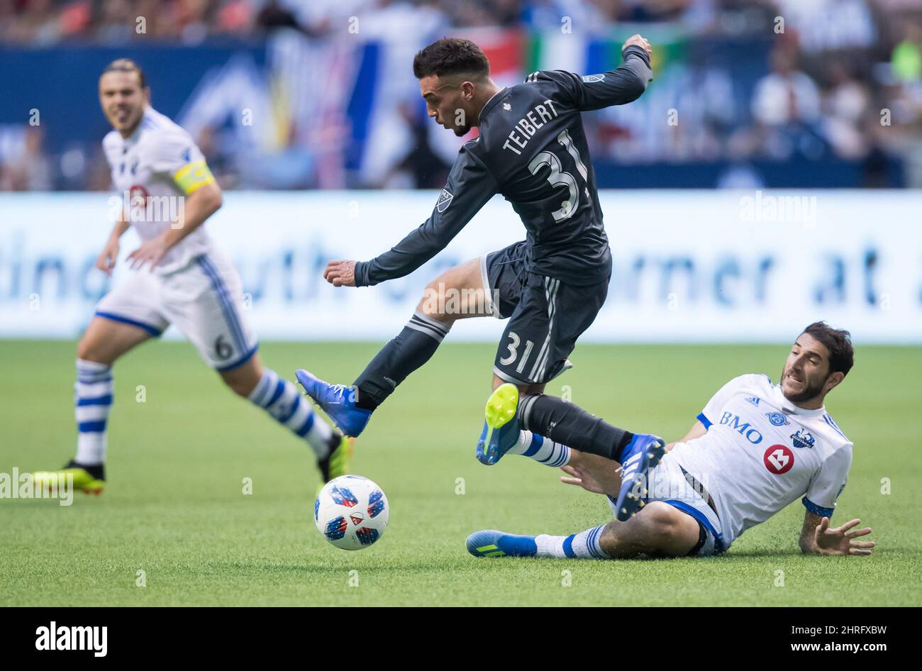 Vancouver Whitecaps' Russell Teibert (31) escapes a tackle by Montreal ...