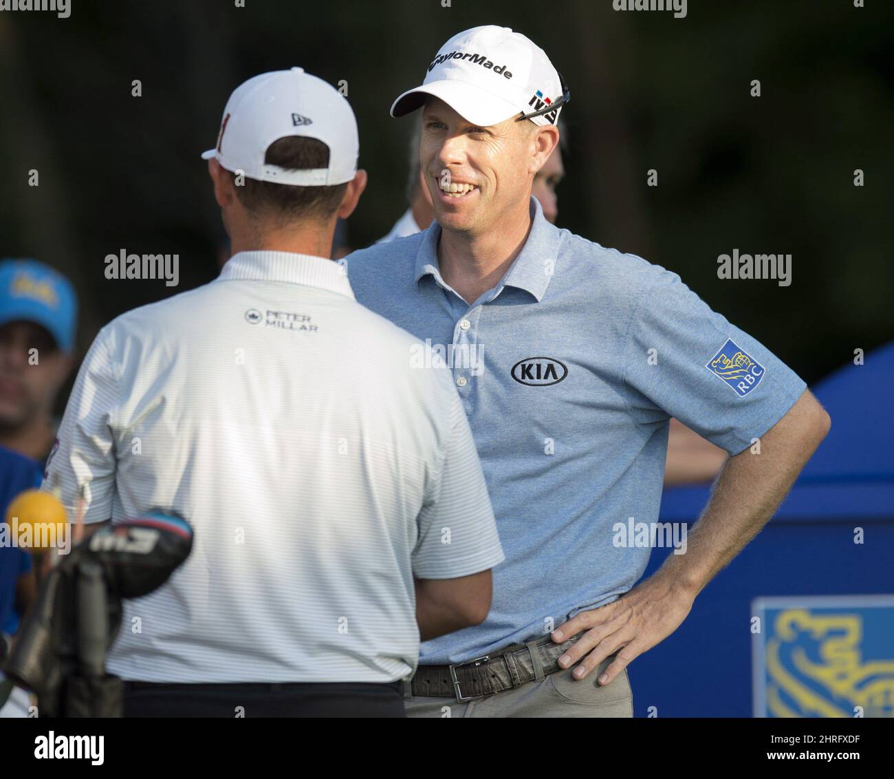 David Hearn, right, of Canada, smiles as he chats with Chez Reavie, of ...