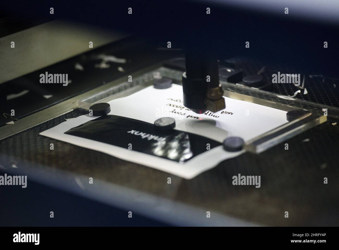 A laser cutter used to make tattoo designs is photographed in Inkbox, a ...