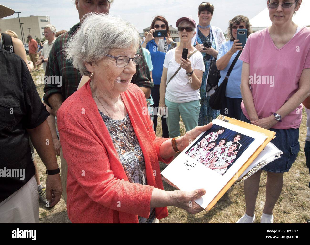 Annette Dionne, one of the two surviving Dionne quintuplets, holds a ...