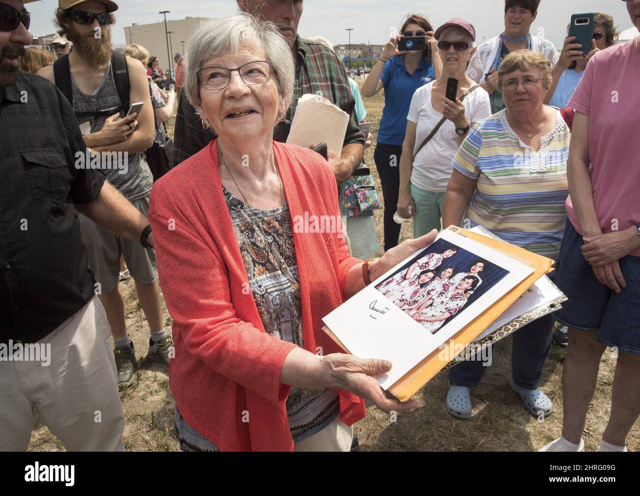 Annette Dionne, one of the two surviving Dionne quintuplets, holds a ...