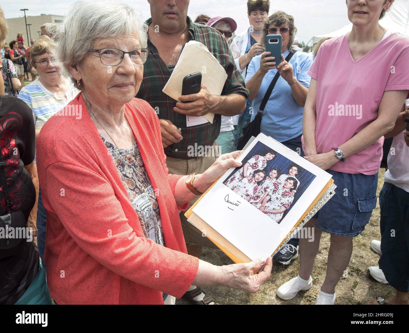 Annette Dionne, one of the two surviving Dionne quintuplets, holds a ...