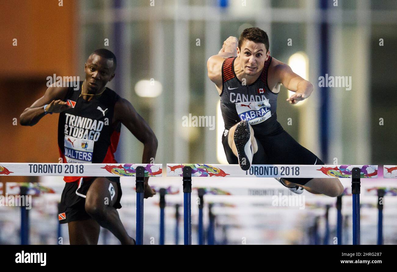 Johnathan Cabral, of Canada, competes in the 110m hurdles ahead of ...
