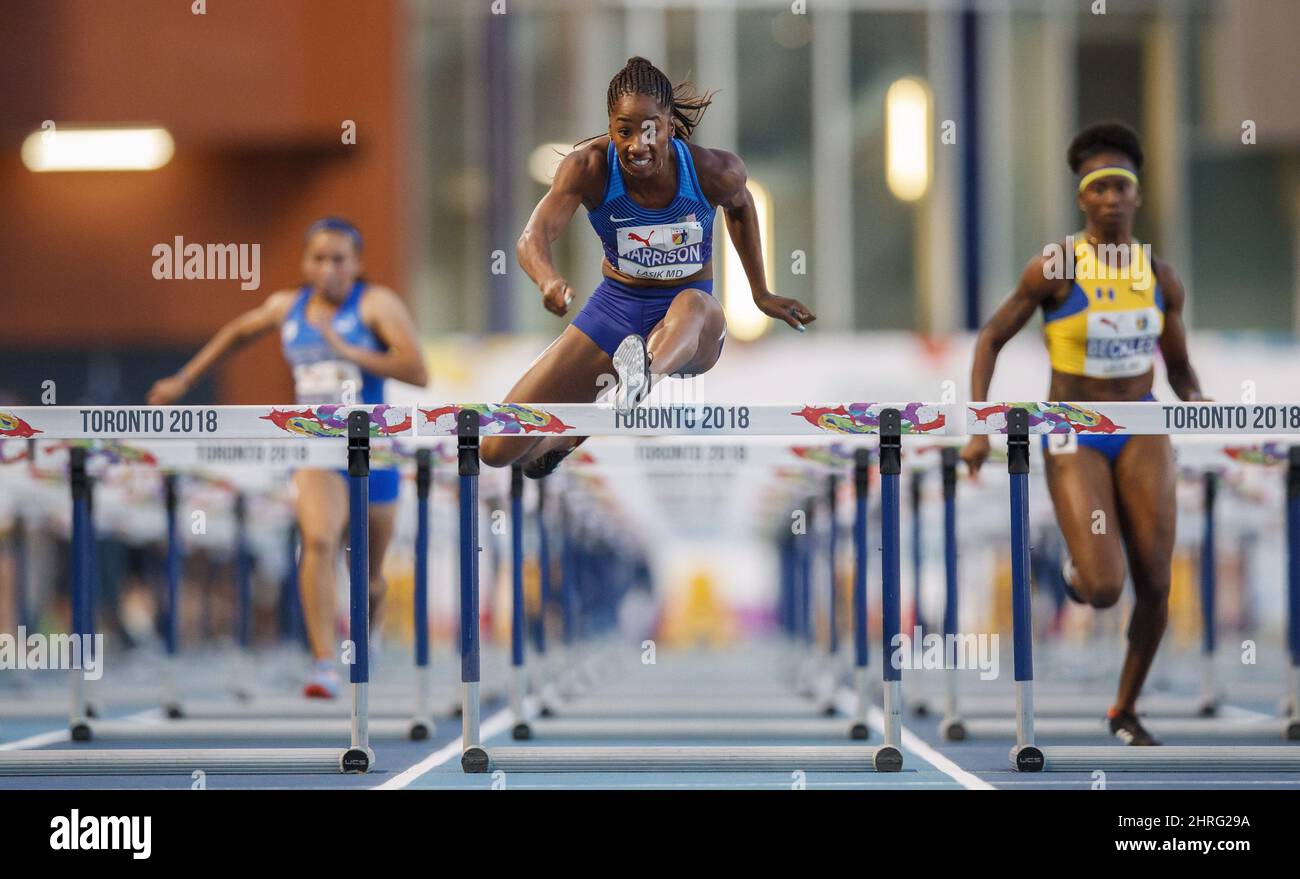 Queen Harrison, of the United States, competes in the 100m hurdles ...