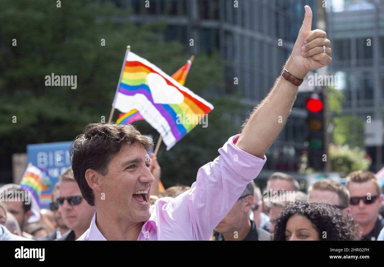 Prime Minister Justin Trudeau Salutes The Crowd As He Marches In The Pride Parade In Montreal On