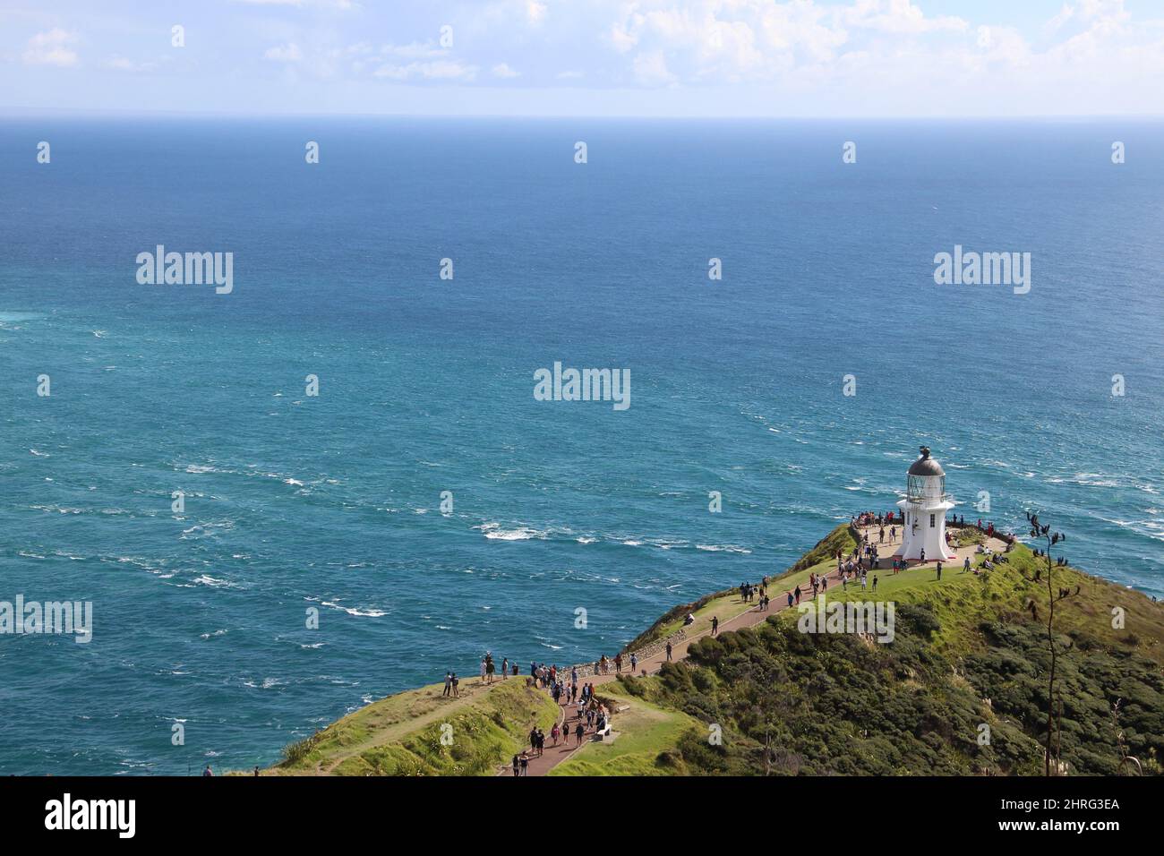 Shot of a lighthouse in New Zealand: Cape Reinga. Where the oceans meet ...