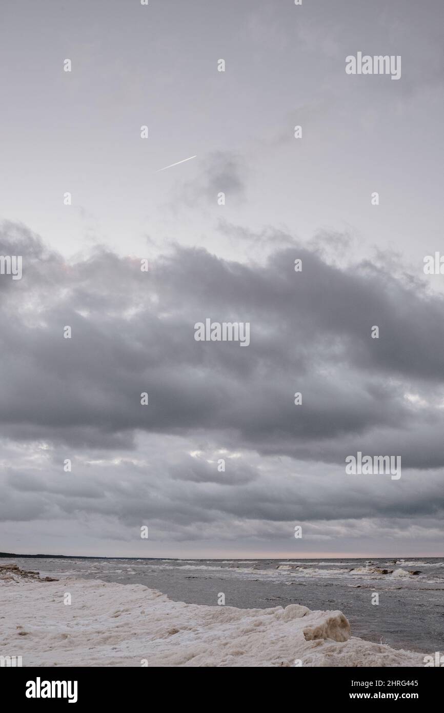 Vertical shot of some dramatic clouds in the sky over the sea Stock ...