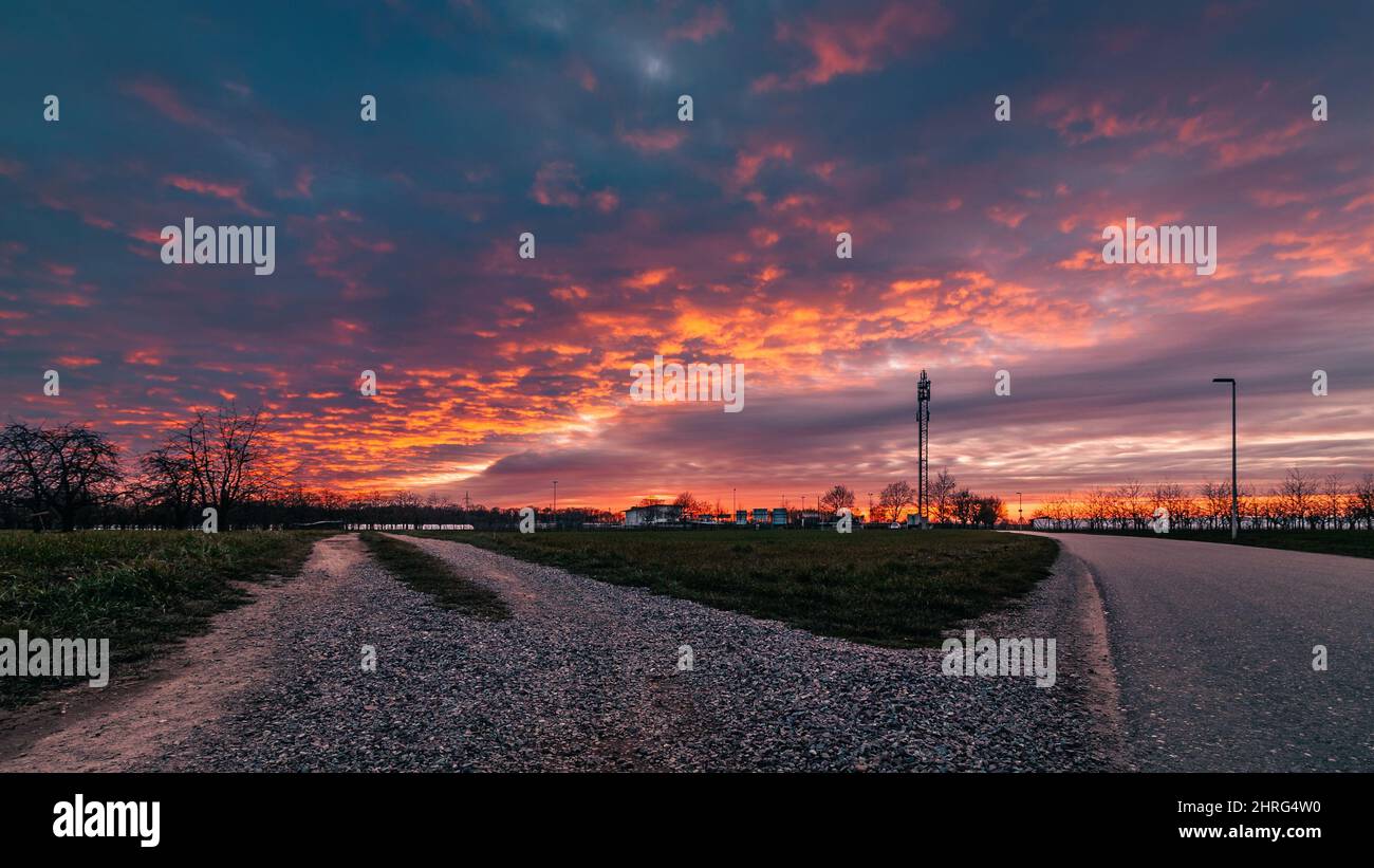 Beautiful and colorful sunset and a view of a road. Great for ...
