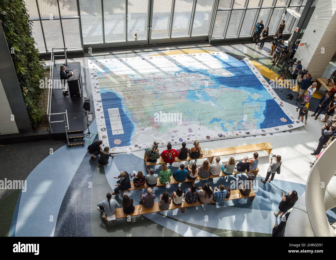 A giant map from the Indigenous Peoples Atlas of Canada is revealed at ...