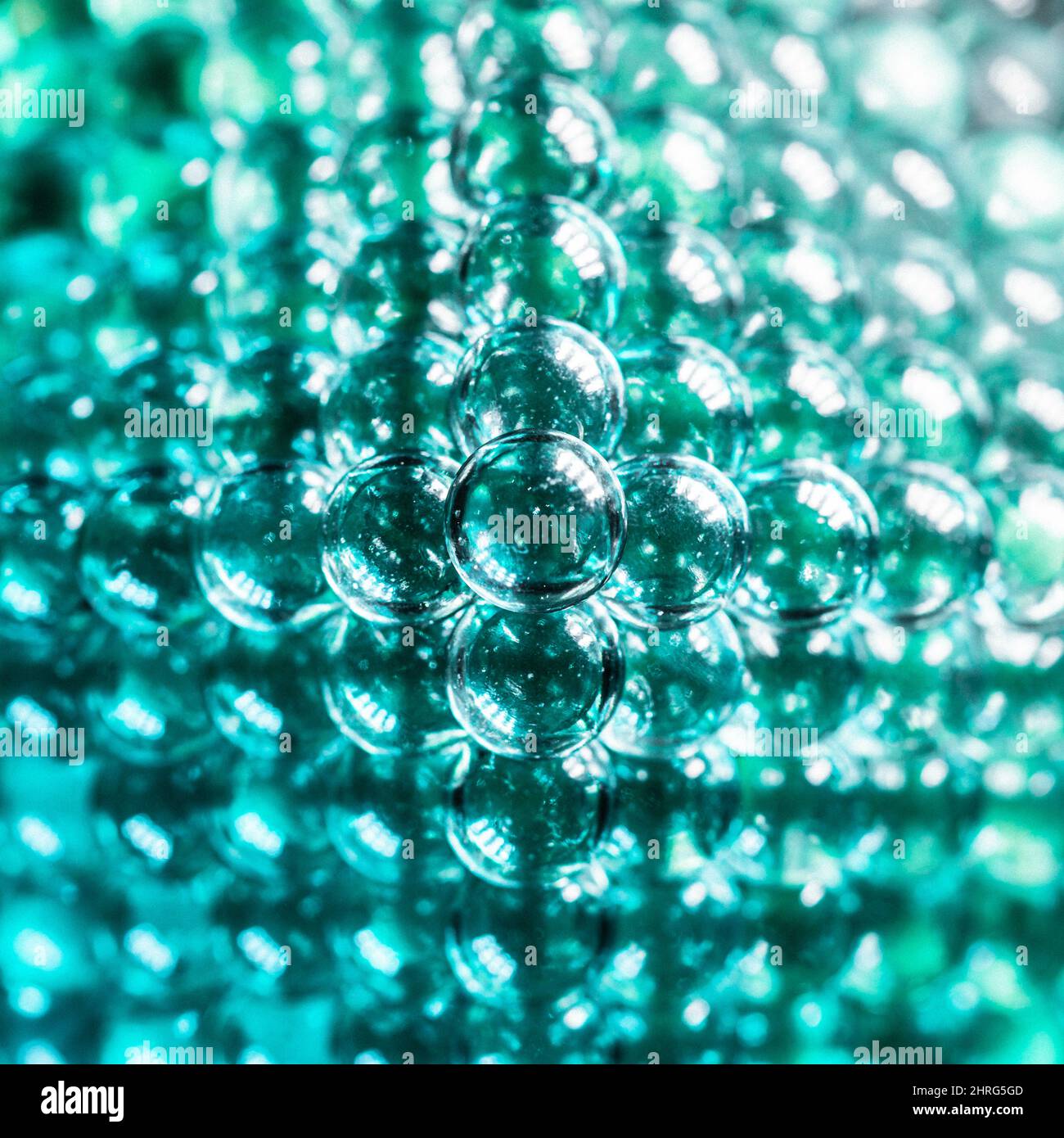 Macro shot of lit aqua marbles forming a pyramid Stock Photo - Alamy