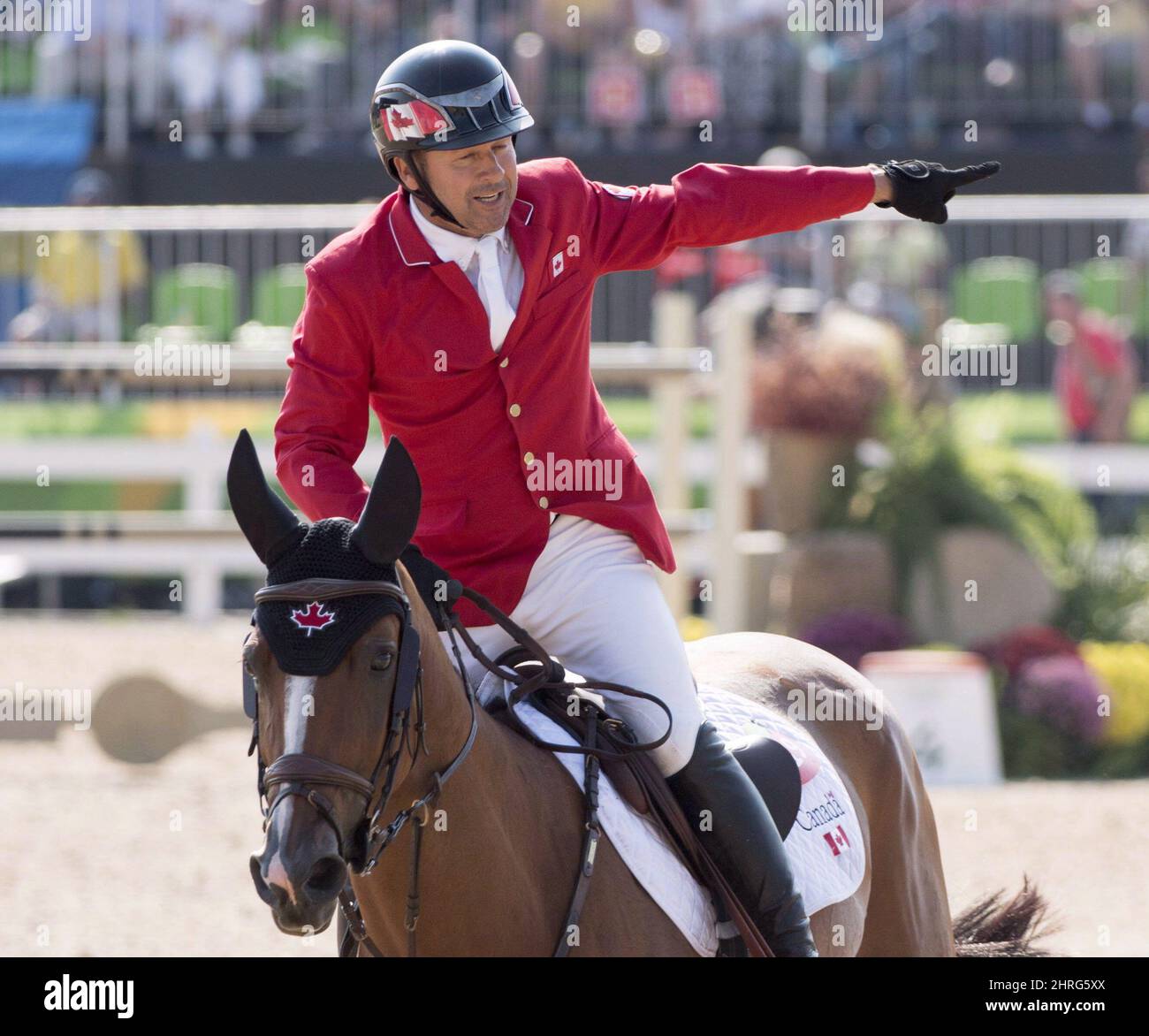 Canada's Eric Lamaze, from Schomberg, Ont., reacts after his first ...