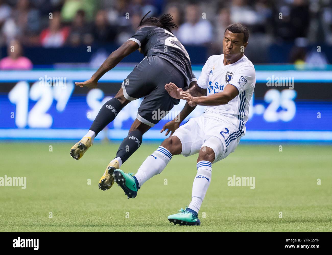 Vancouver Whitecaps' Yordy Reyna, left, and San Jose Earthquakes' Joel ...