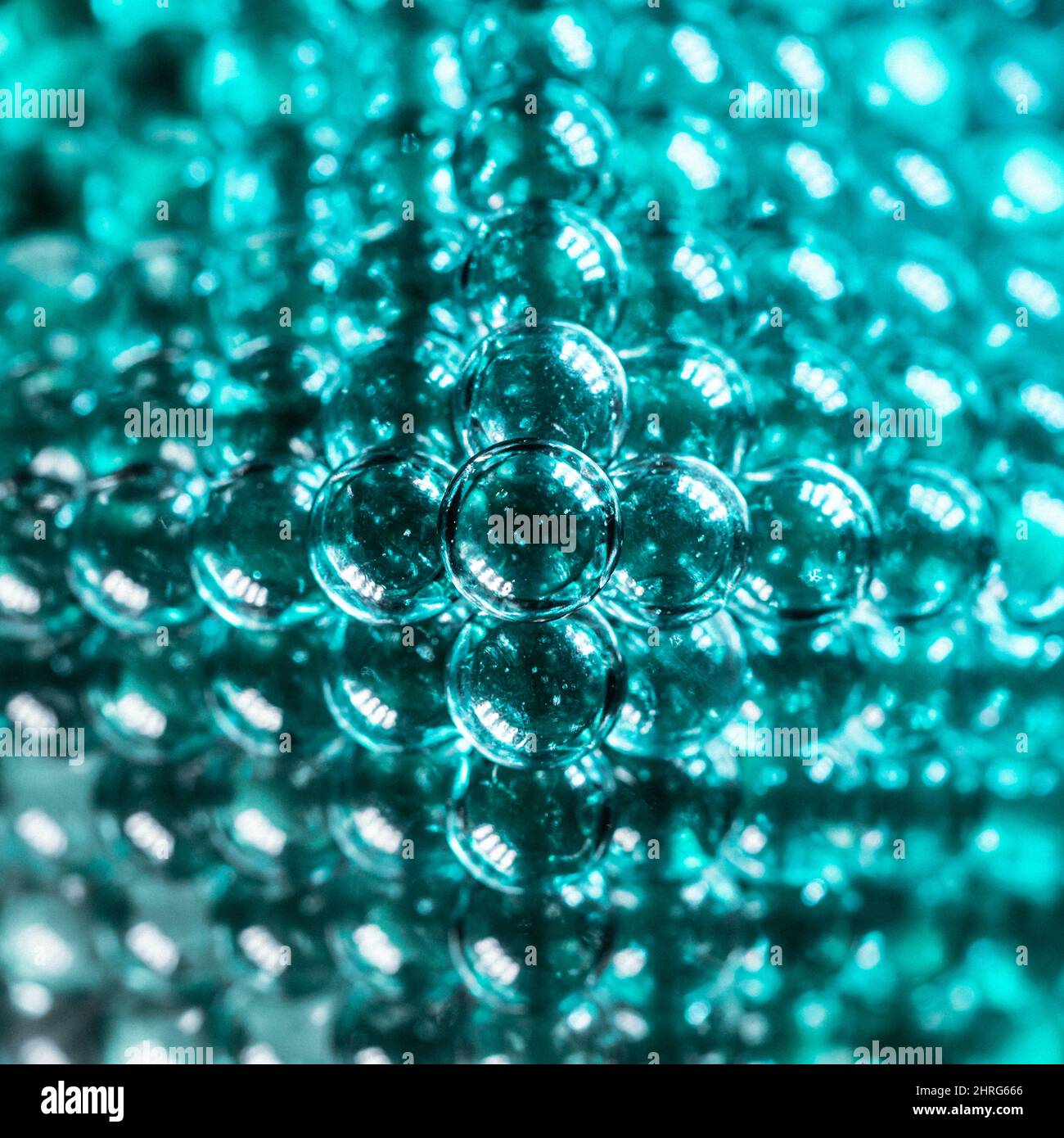 Macro shot of lit aqua marbles forming a pyramid Stock Photo - Alamy