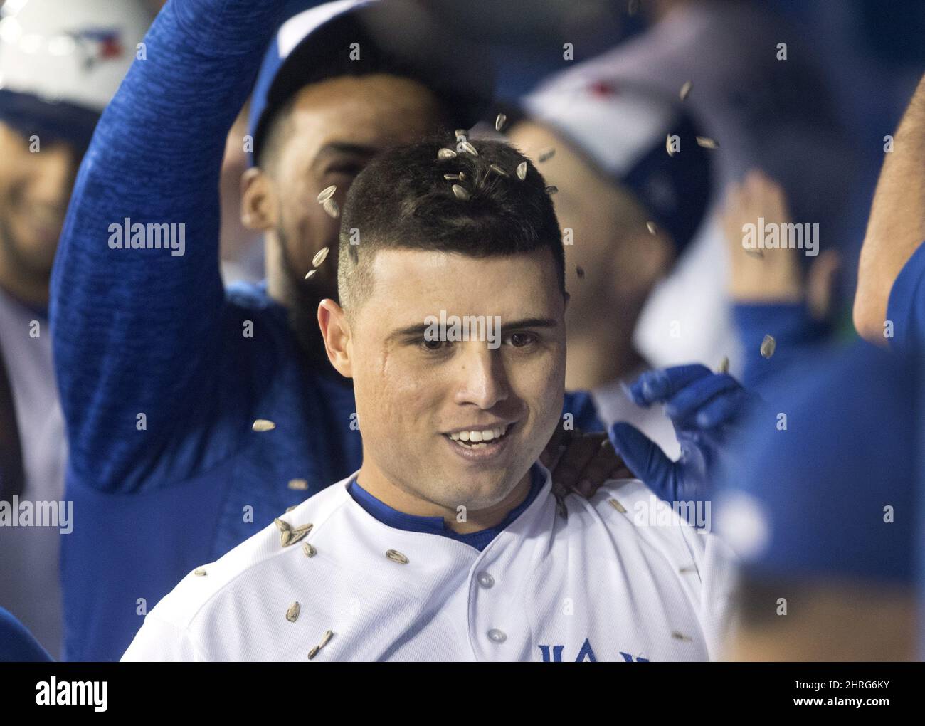 Toronto Blue Jays' Aedmys Diaz showered with sunflower seeds after he ...
