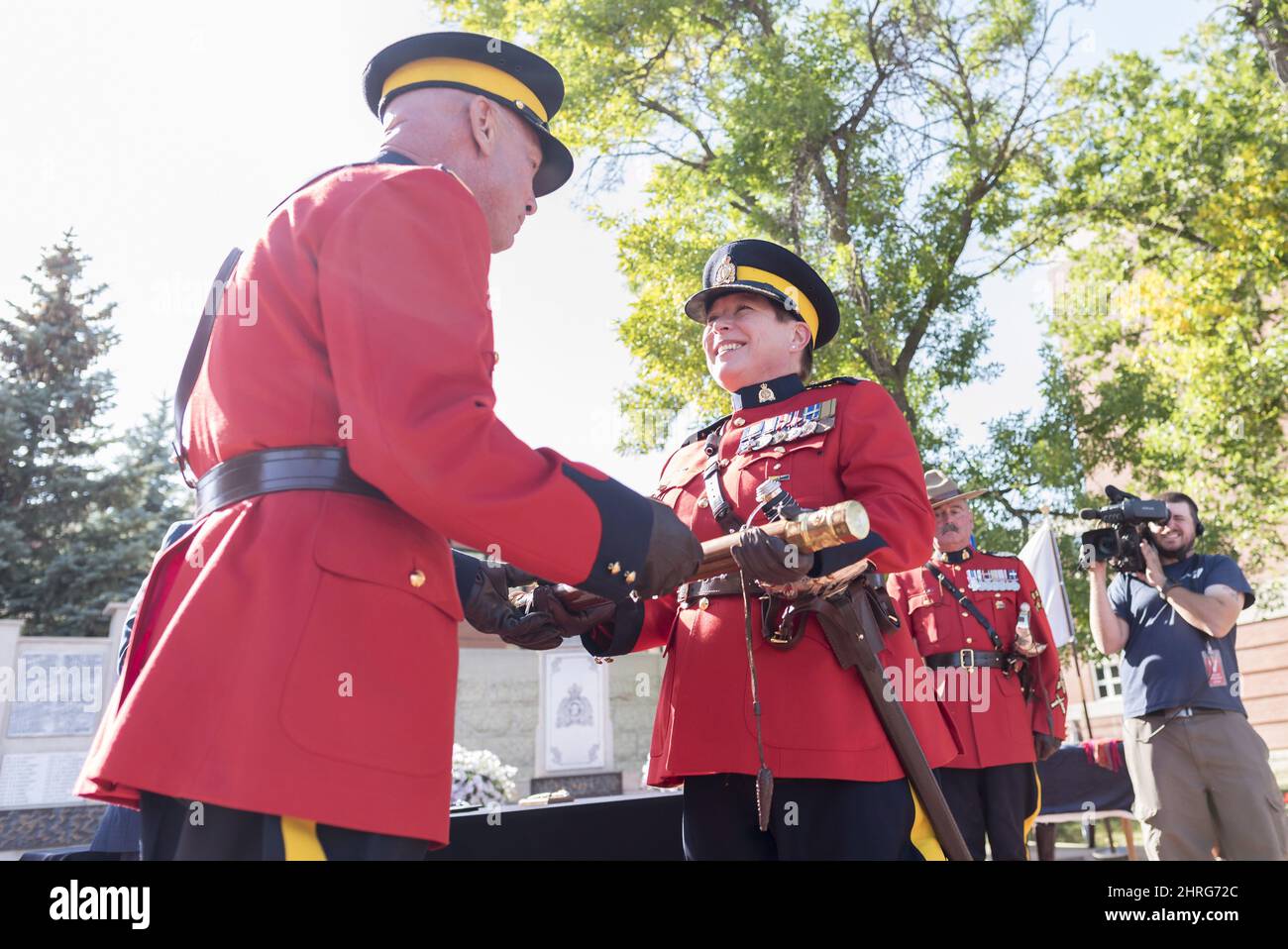 Outgoing RCMP Commissioner Bob Paulson, left, presents incoming RCMP ...