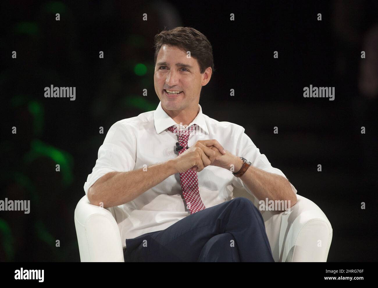 Prime Minister Justin Trudeau smiles as he recognizes the audience ...