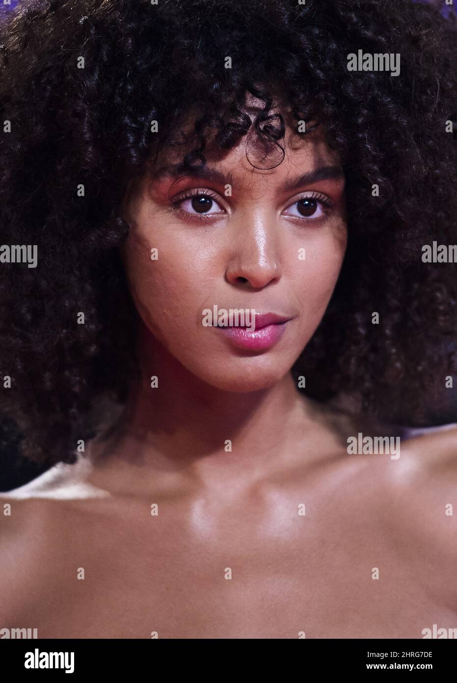 Singer Arlissa poses for photographs on the red carpet after arriving ...
