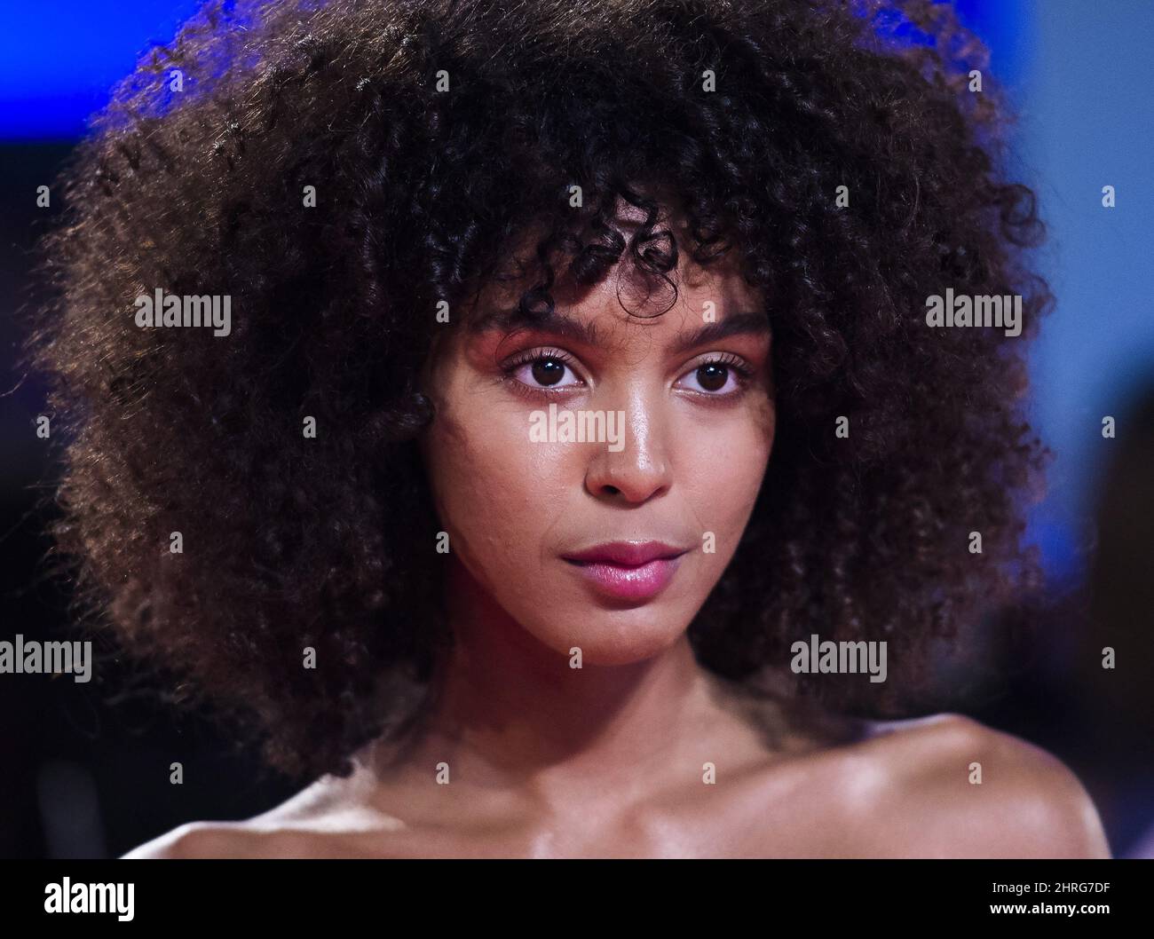 Singer Arlissa poses for photographs on the red carpet after arriving ...