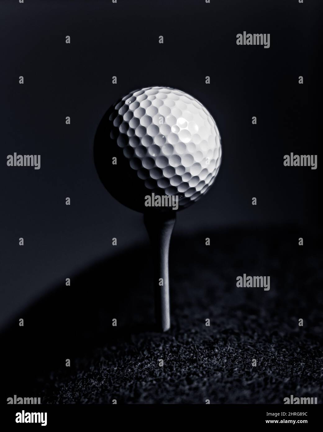 Vertical grayscale shot of a golf ball on a stick Stock Photo - Alamy