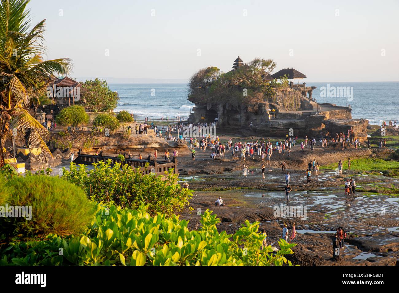Famous Hindu temple facing the ocean in a small Tanah Lot islet in Bali ...
