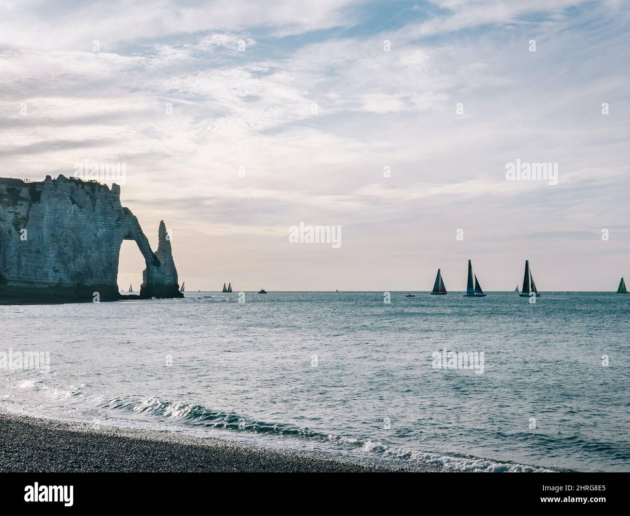 Porte D'Aval rock formation in Etretat, France during the sunset Stock ...