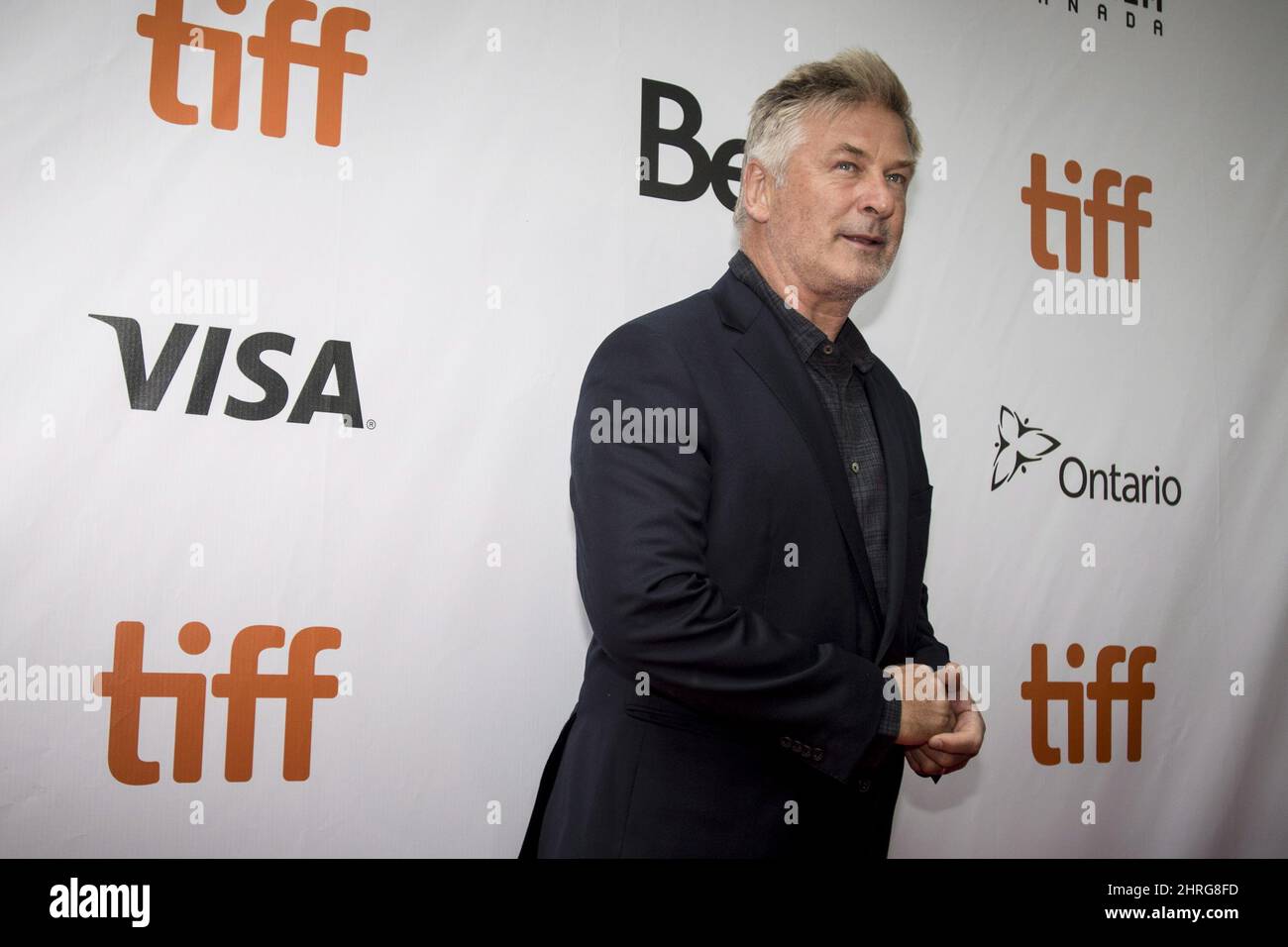 Actor Alec Baldwin poses for photos on the red carpet for the premiere ...