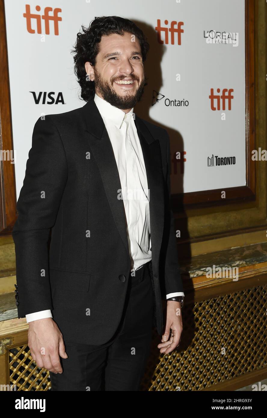 Actor Kit Harrington poses for photographs on the red carpet after ...