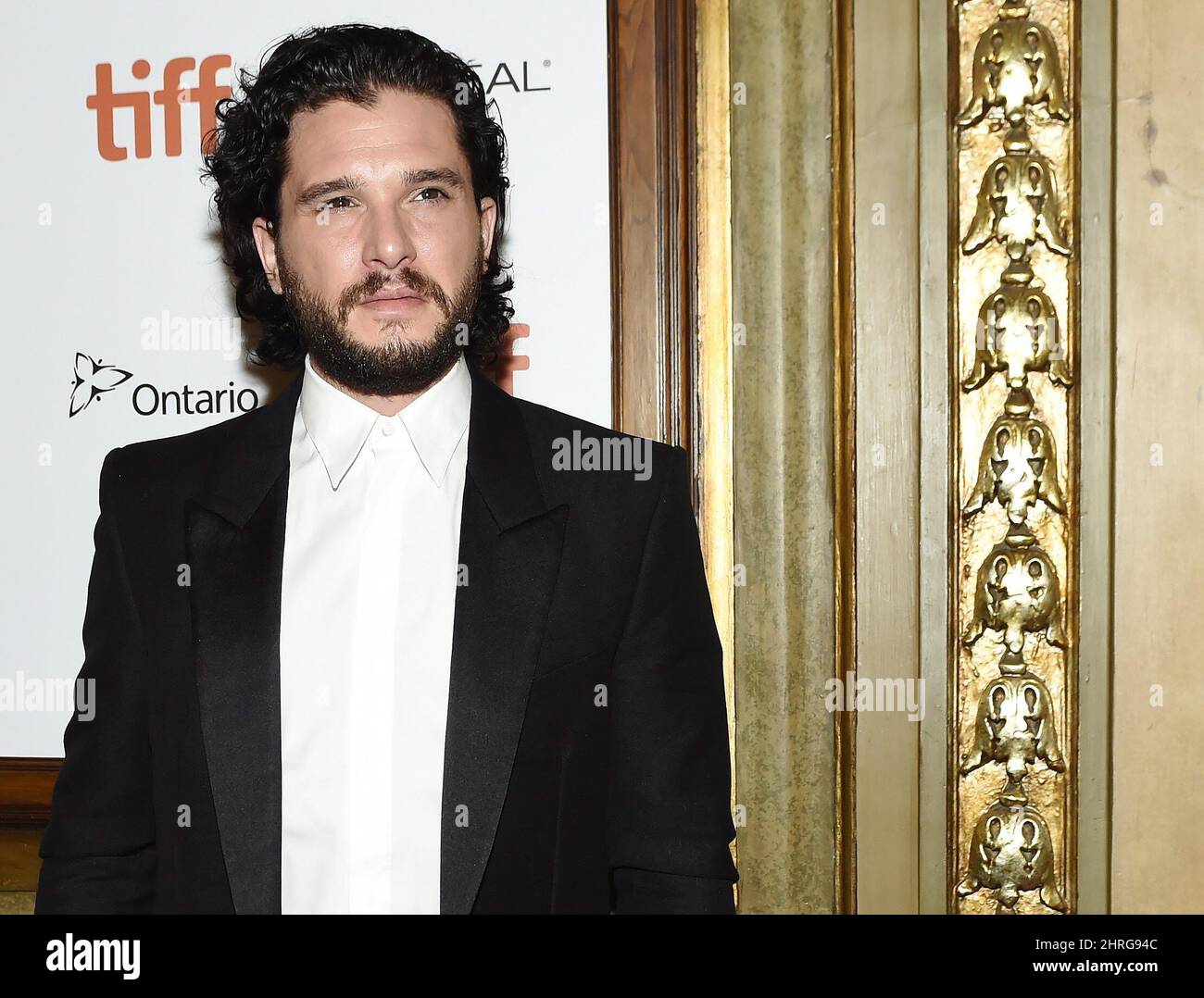 Actor Kit Harrington poses for photographs on the red carpet after ...