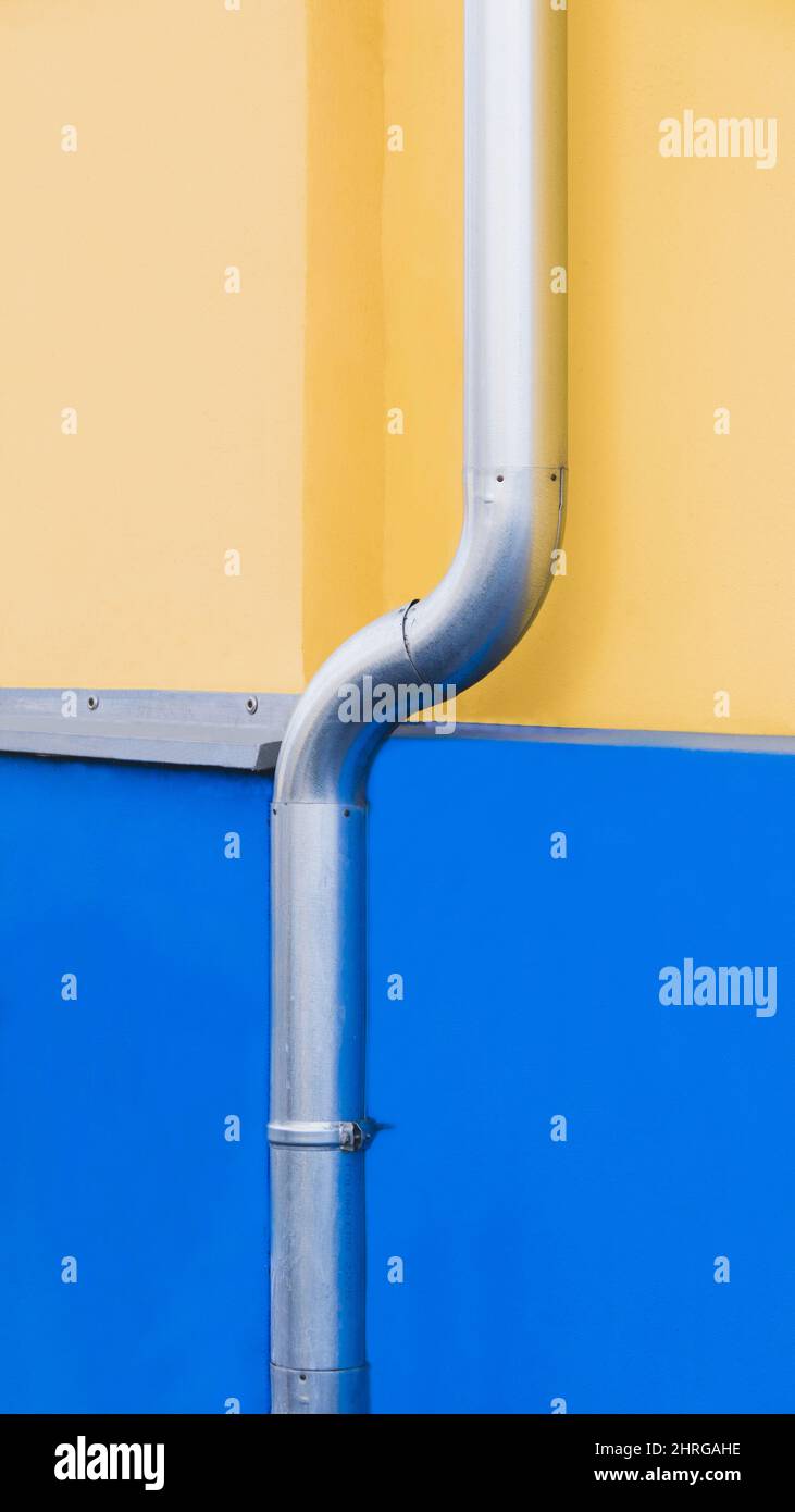 Vertical shot of a water pipe near the wall Stock Photo - Alamy