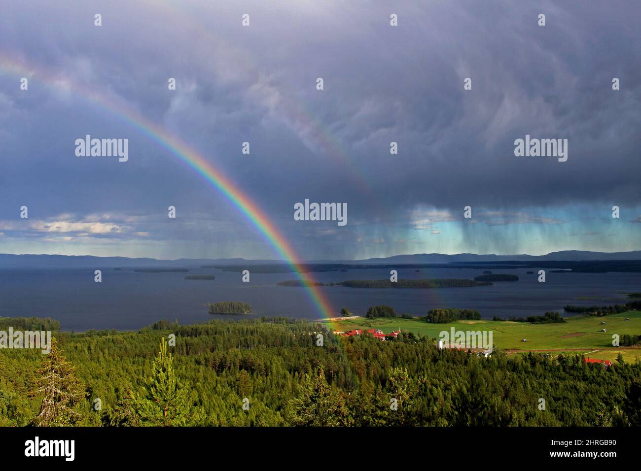 Beautiful shot of the rainbow over the Lake Norra Dellen in Sweden ...