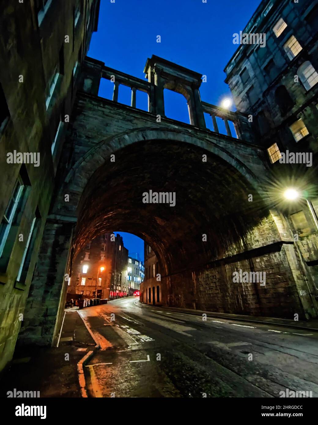 Low angle portrait of an arch tunnel on the streets of Edinburgh in ...