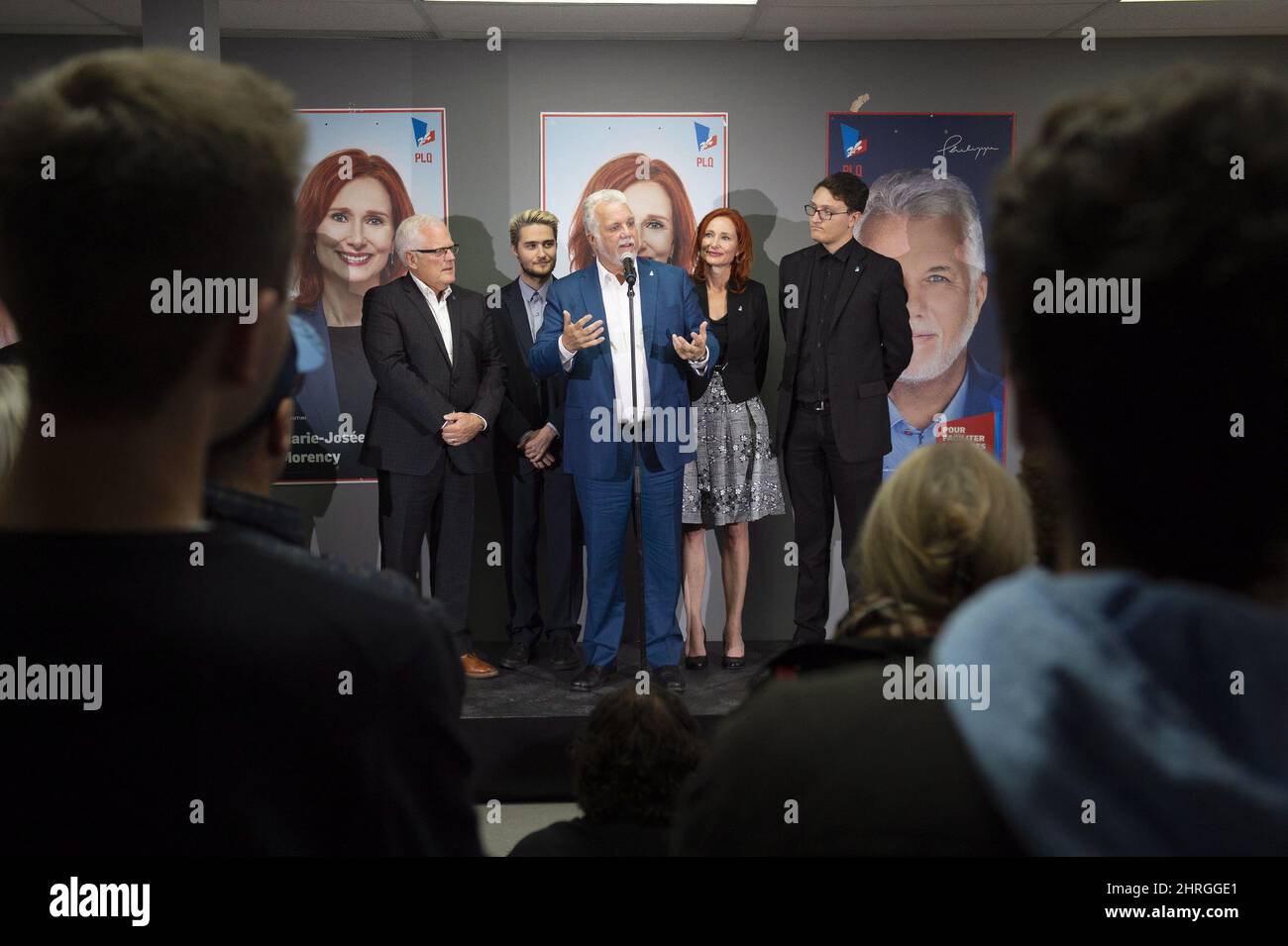 Quebec Liberal Leader Philippe Couillard, flanked by candidates, from ...