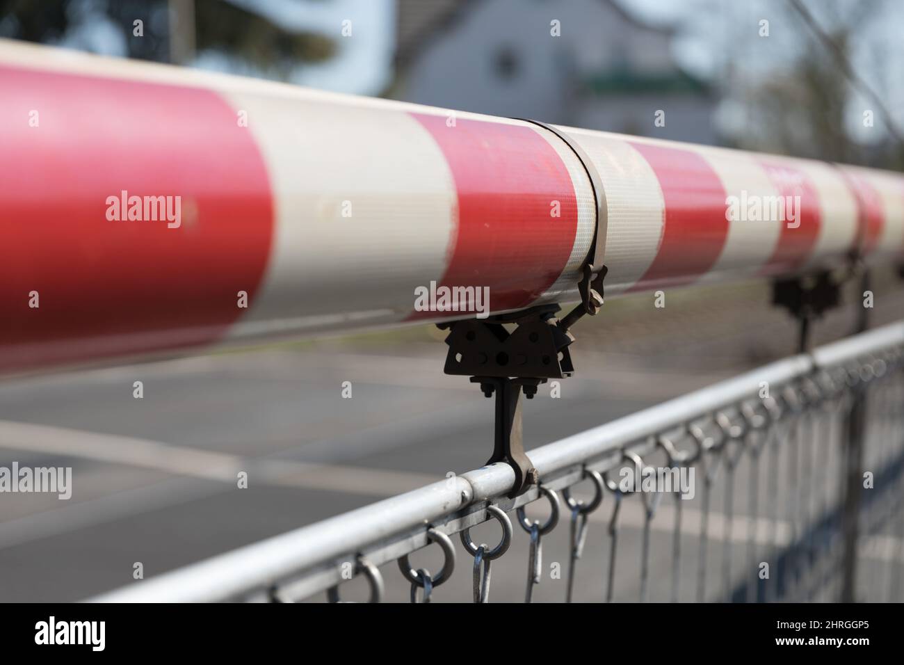 Closed barrier at level crossing Stock Photo - Alamy
