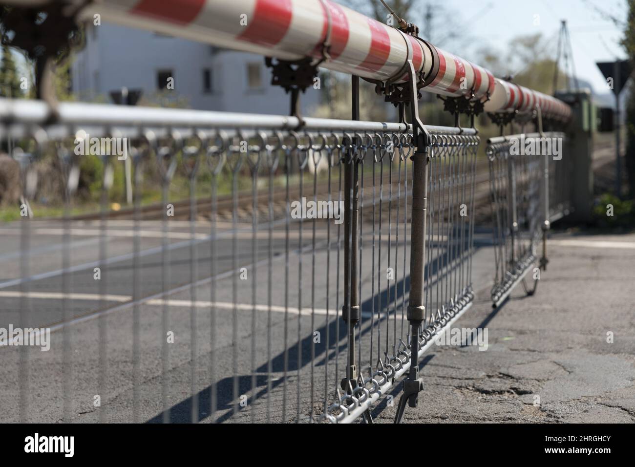 Closed barrier at level crossing Stock Photo - Alamy