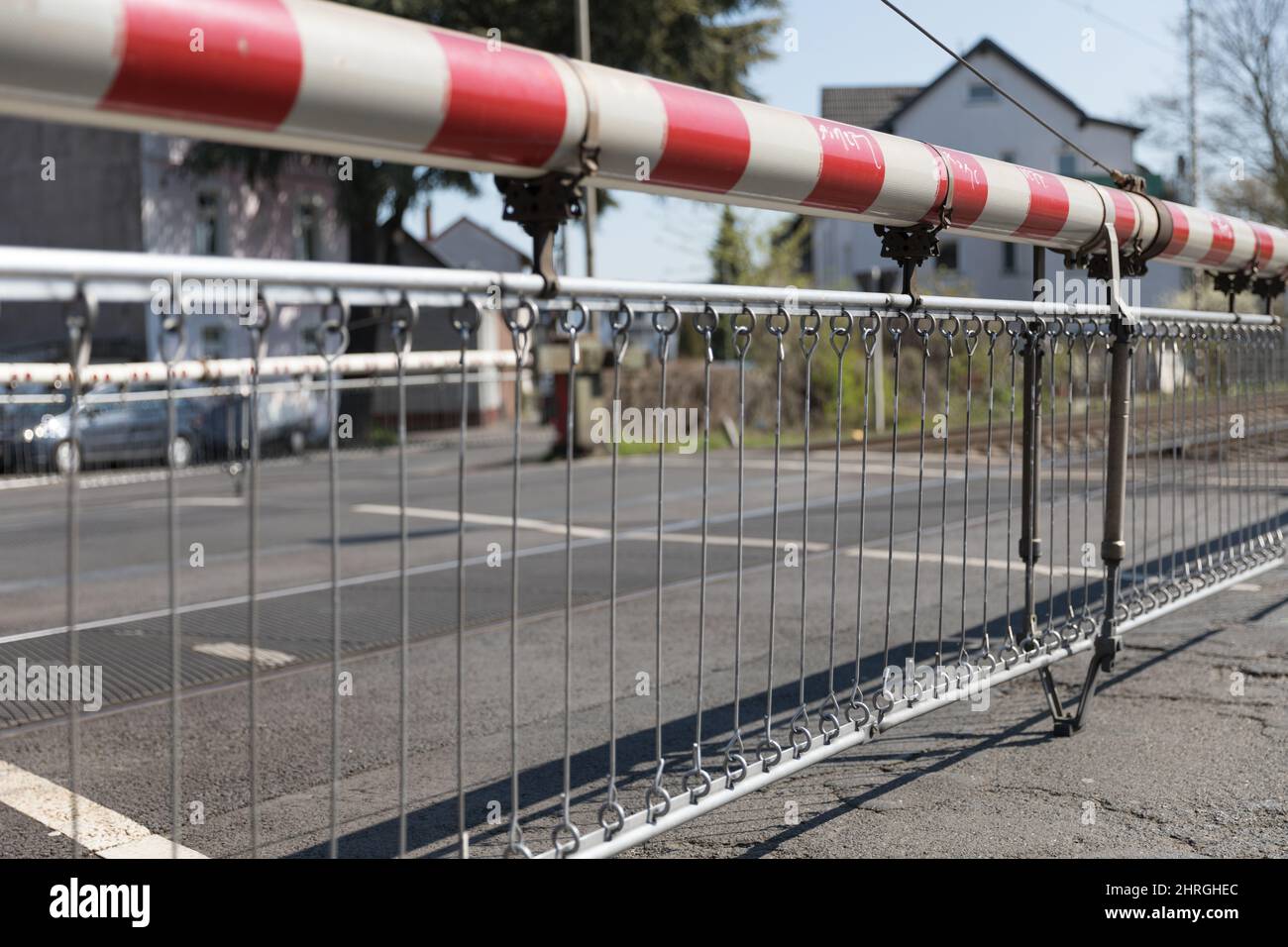 Closed barrier at level crossing Stock Photo - Alamy