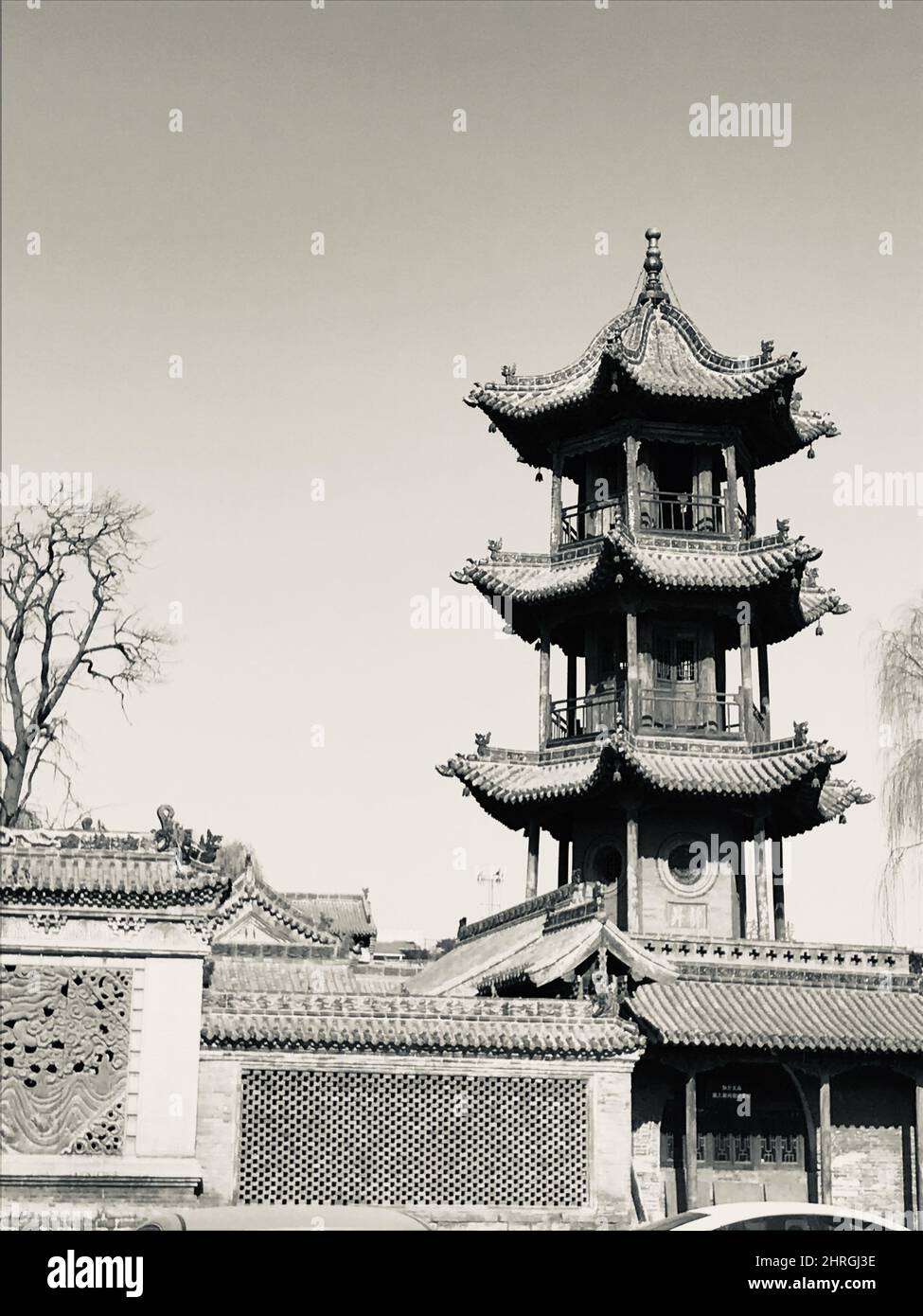Grayscale of an old architectural temple tower in china Stock Photo - Alamy