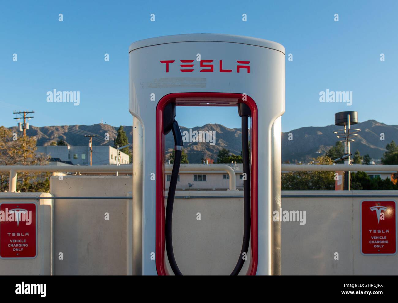 Tesla charging station with mountains in background Stock Photo - Alamy