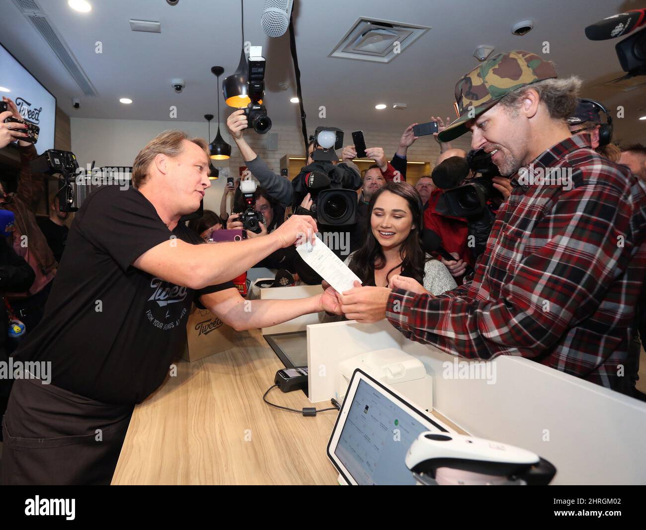 Canopy Growth CEO Bruce Linton, left to right, provides the receipt for ...
