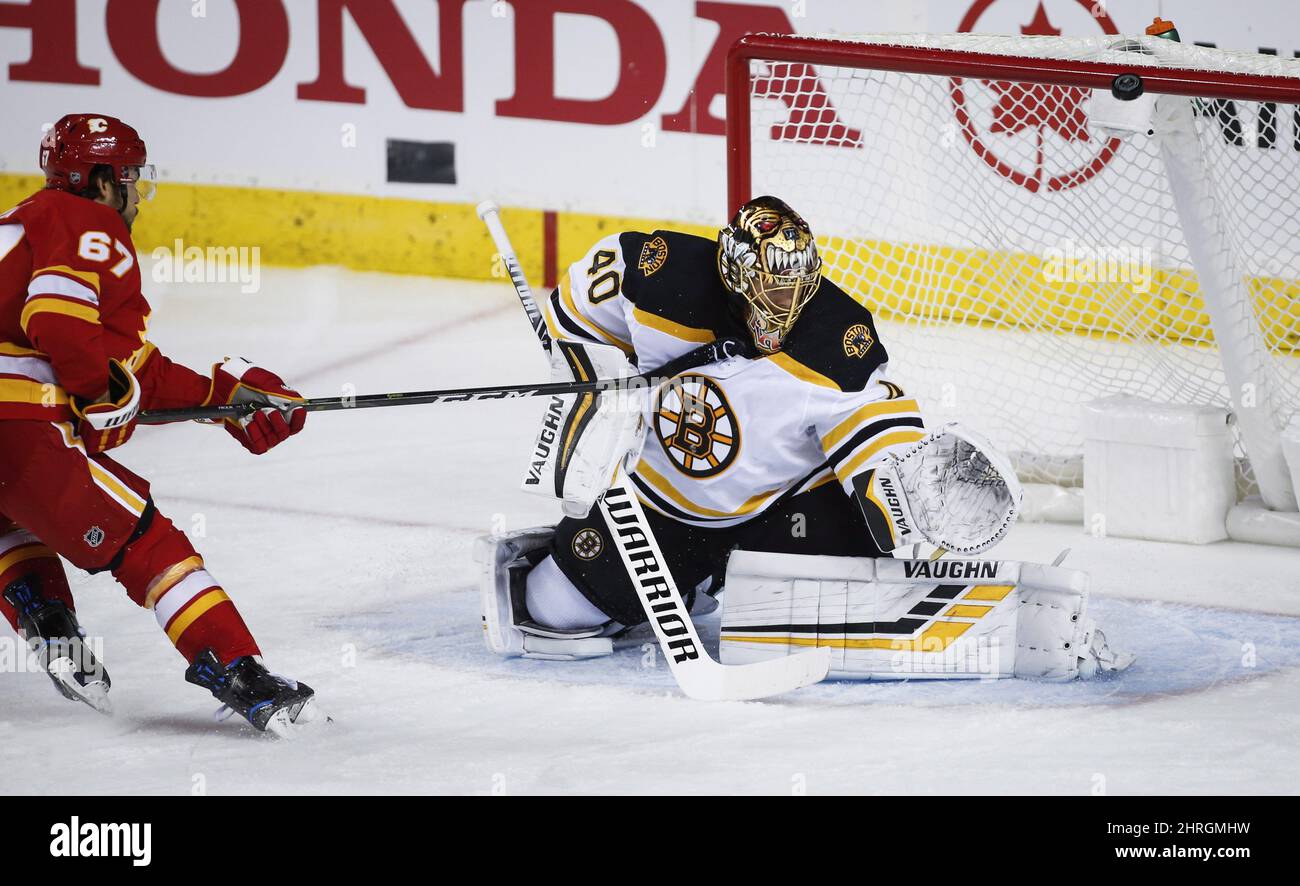 Boston Bruin goalie Tuukka Rask, right, of Finland, looks back as ...