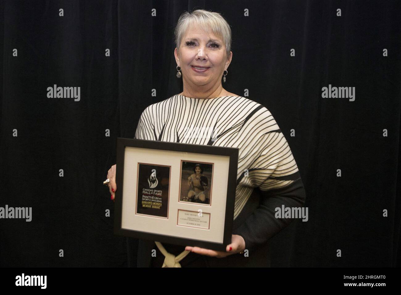 Maureen Baker (daughter of Mary Baker) poses for a photo after a media event in Toronto, as her ...