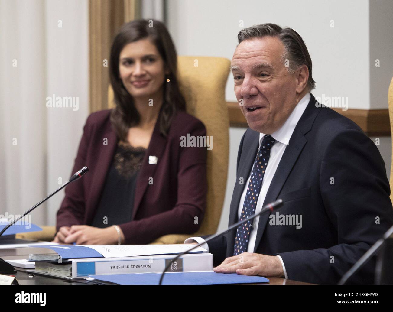 Quebec Premier Francois Legault, right, presides over his first cabinet ...