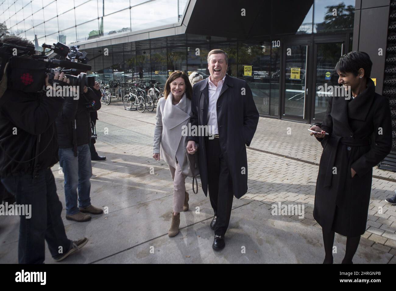 Toronto Mayor John Tory leaves a voting station with his wife Barbara ...