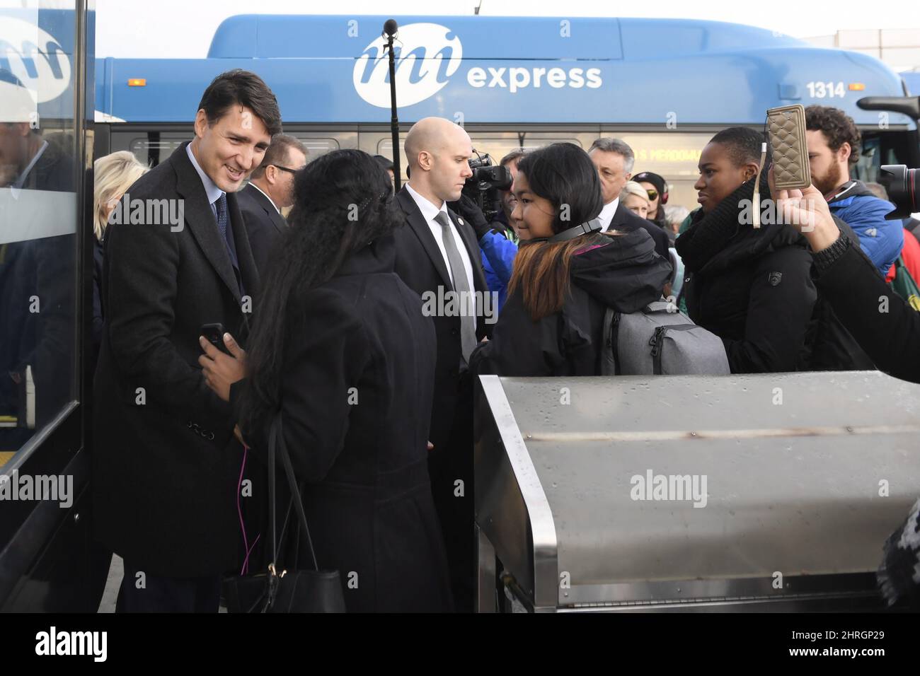Prime Minister Justin Trudeau greets commuters at the City Centre ...