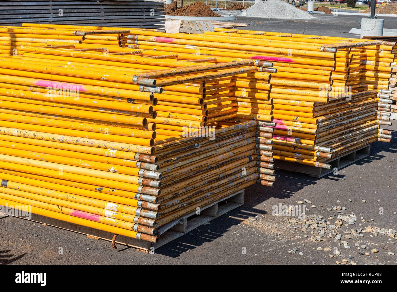 Horizontal shot of stacked scaffolding at a new construction job site ...