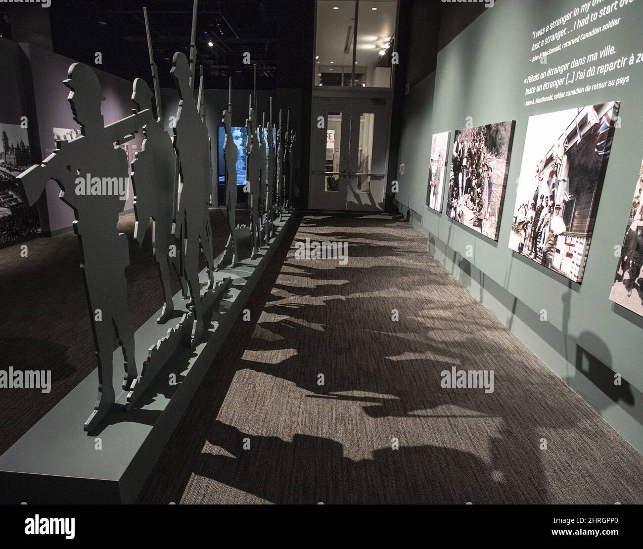 Wooden cutouts depicting Canadian soldiers returning home from the ...
