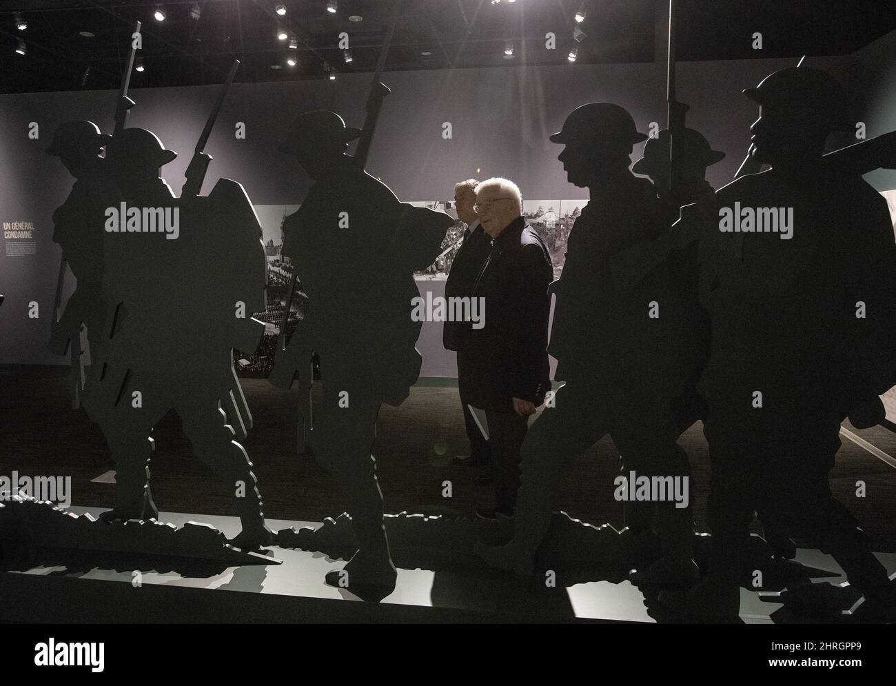 Military historians and curators Tim Cook and Jack Granatstein walk by ...